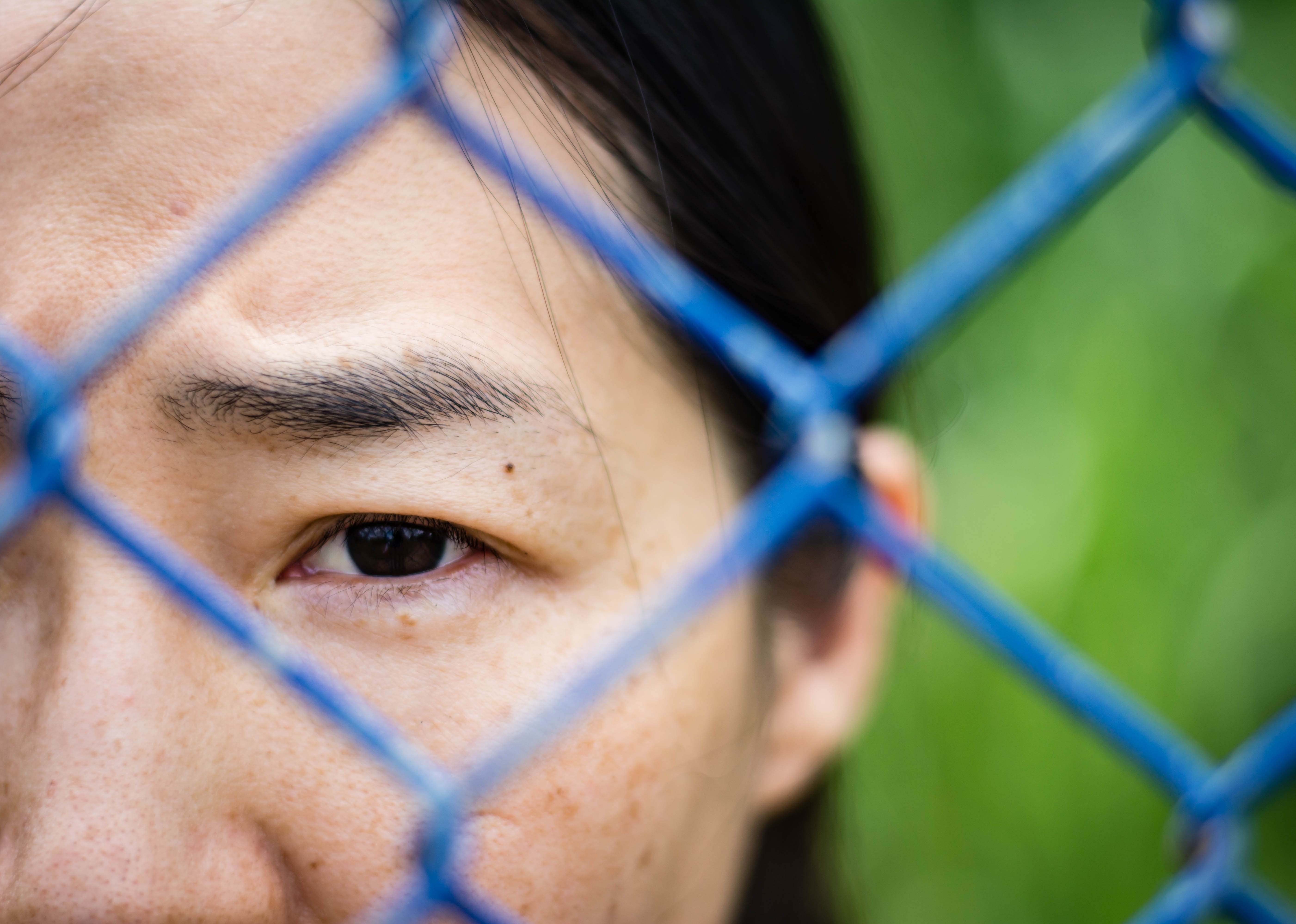 woman face behind a fence – KIWANIS MAGAZINE